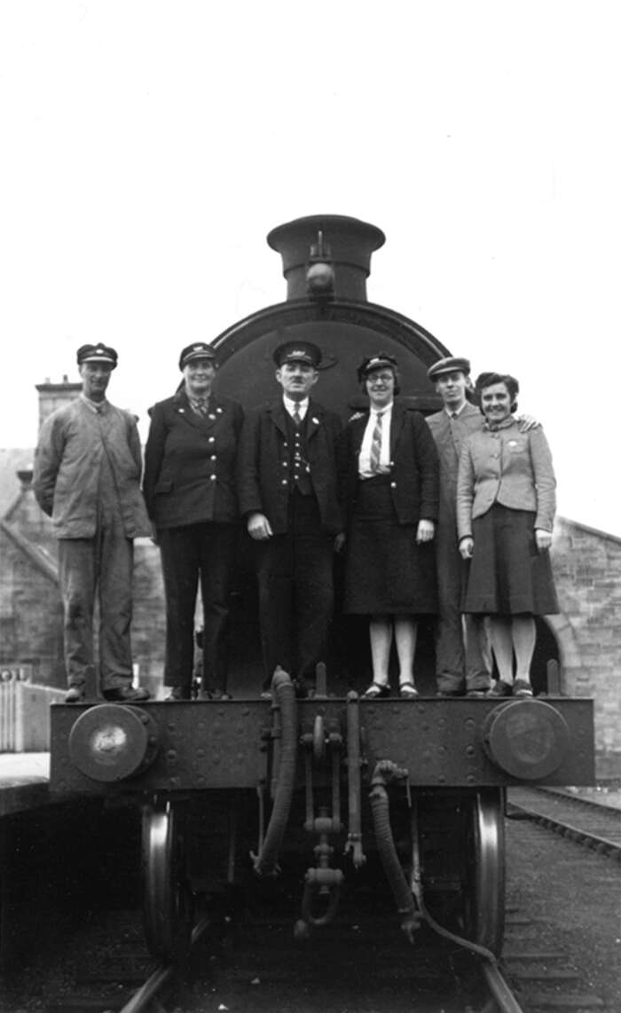 Railway staff on front footplate of locomotive, 1943 | ScotlandsPeople