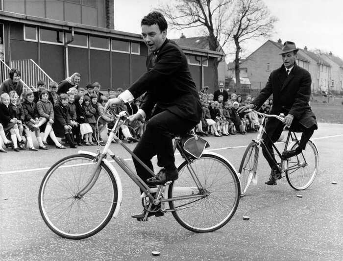 Actors Peter Byrne and Geoffrey Adams riding bicycles, 1967 ...