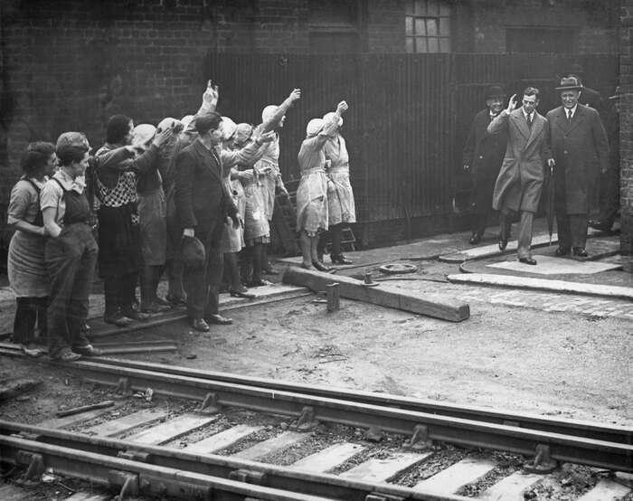 A group of workers greeting HRH Prince George on his visit to the ...